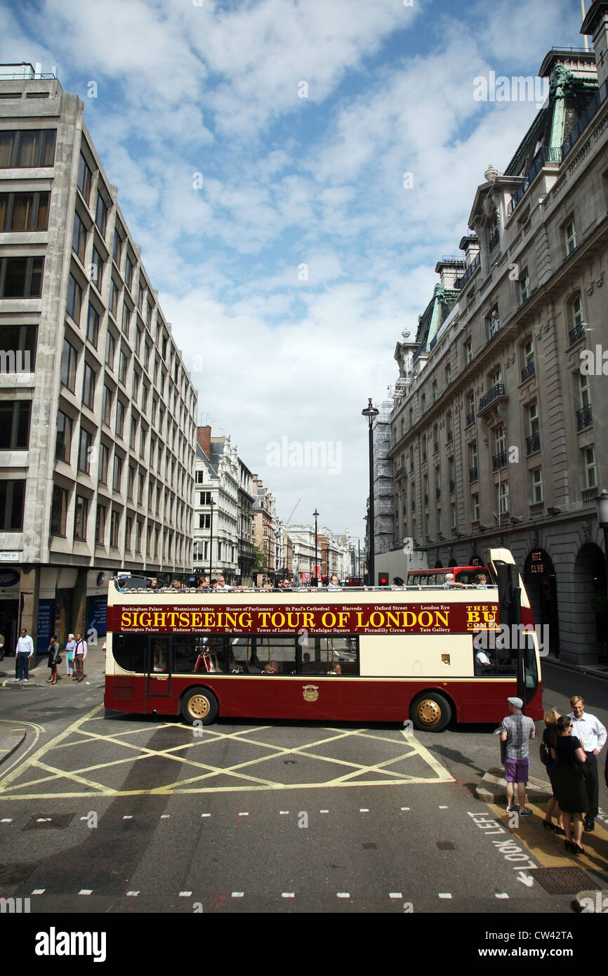 London Sightseeing bus. Tourists love open-top tour bus enable them, a ...