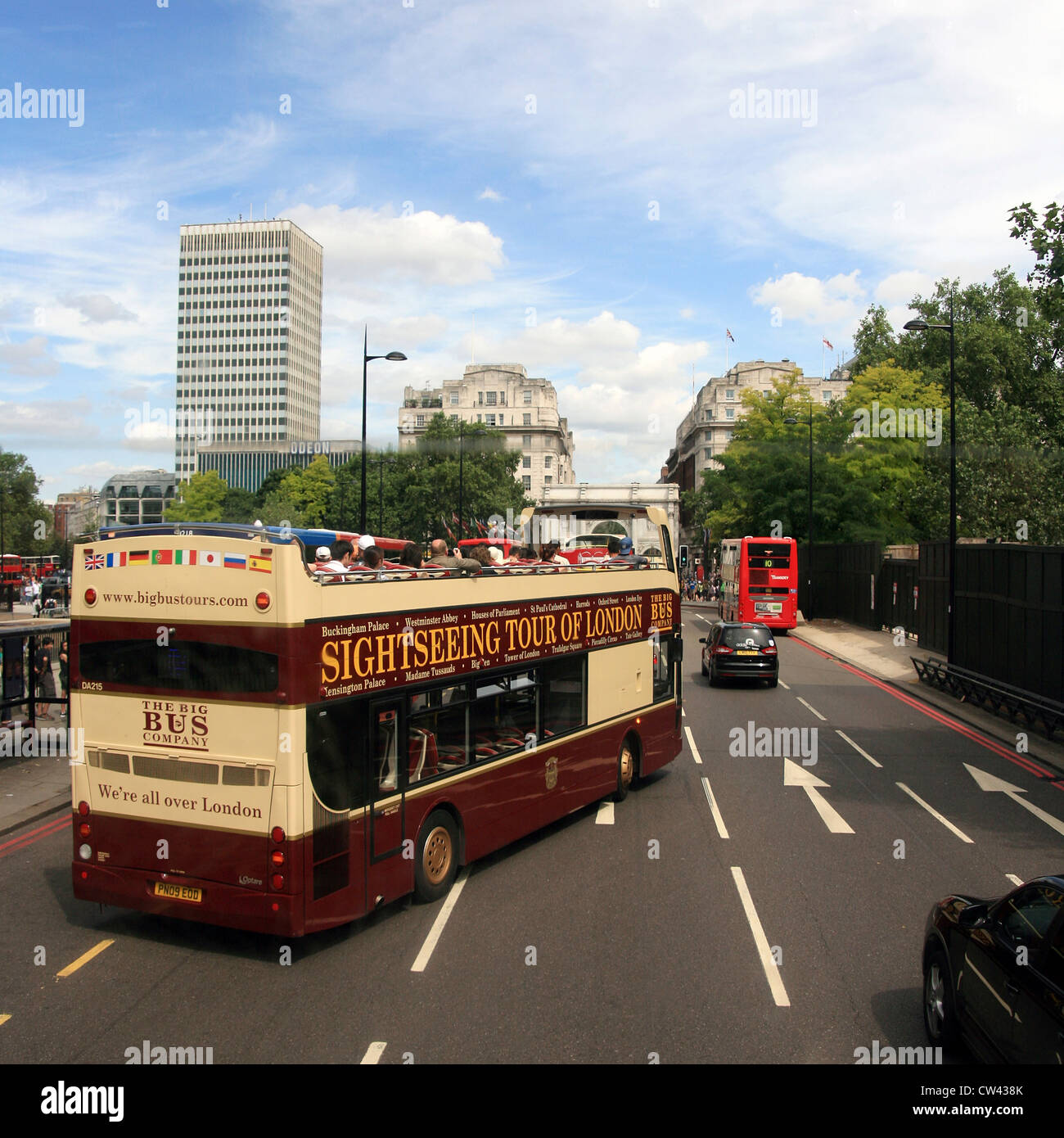 London Sightseeing bus. Tourists love open-top tour bus enable them, a ...