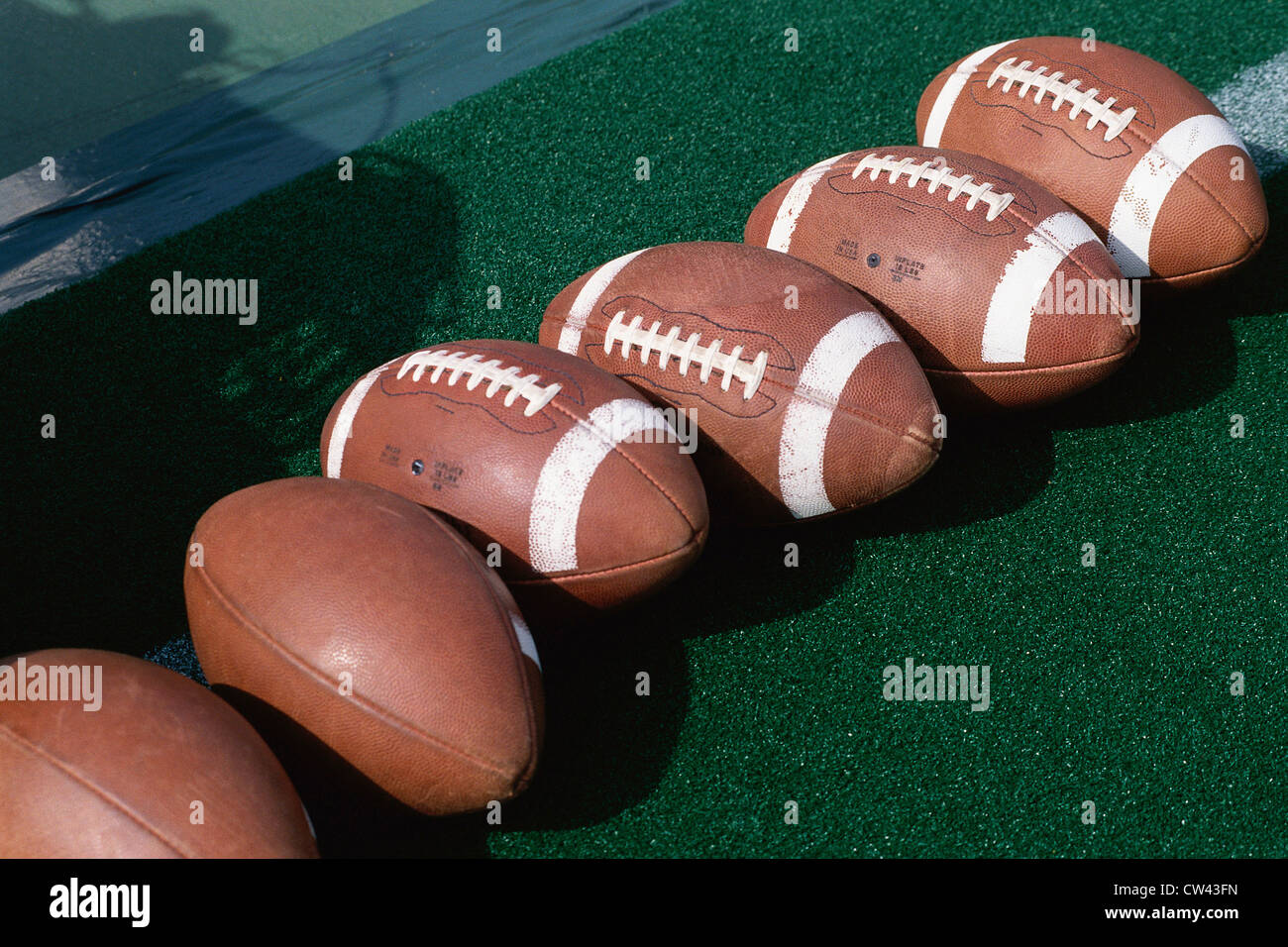 Row of footballs Stock Photo - Alamy