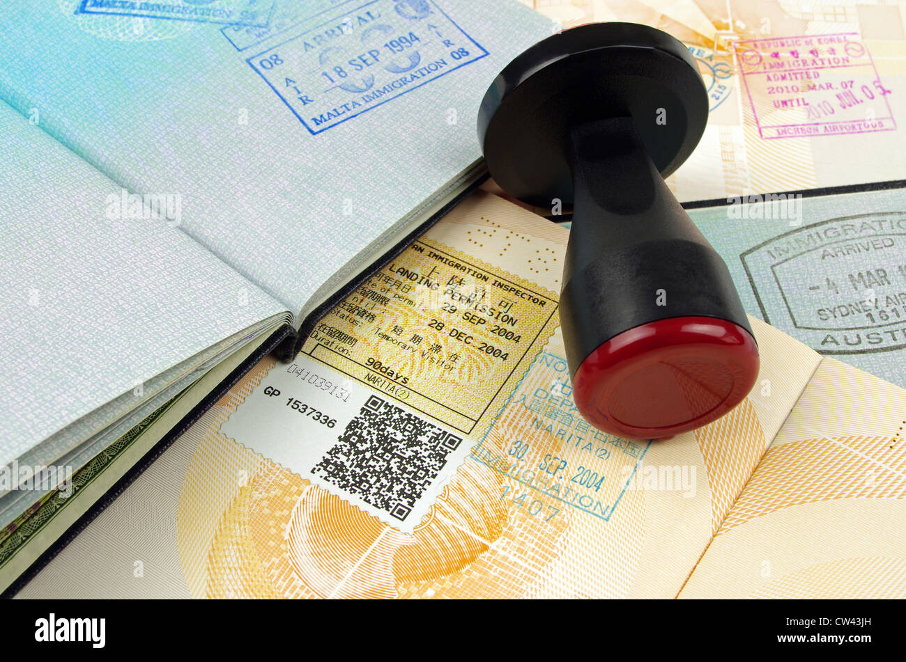 open passport pages with immigration stamps Stock Photo - Alamy