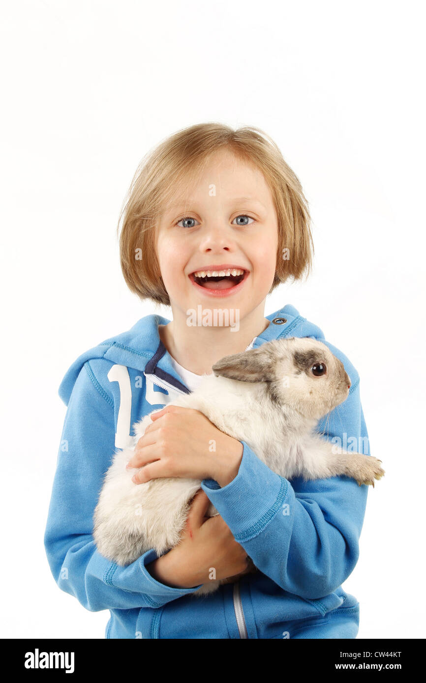 Child holding rabbit hi-res stock photography and images - Alamy