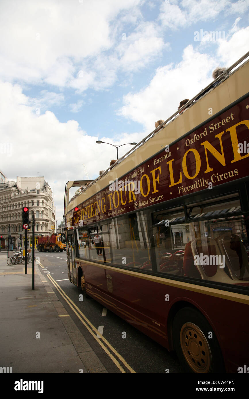 London Sightseeing bus. Tourists love open-top tour bus enable them, a ...