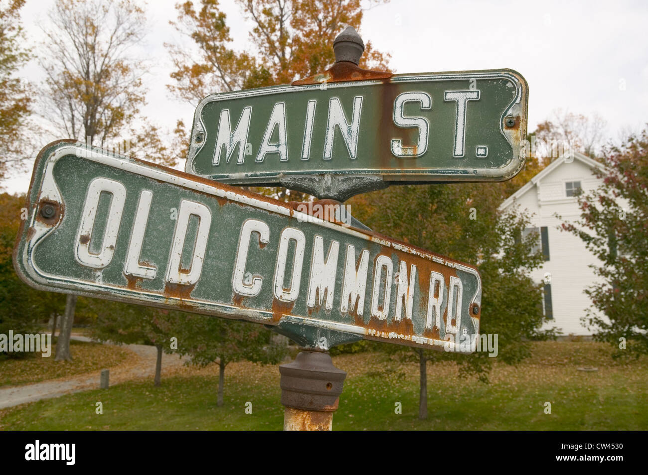 Main Street USA and Old Common Road sign in autumn, western ...