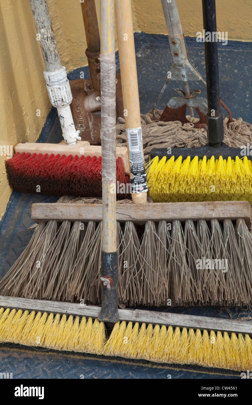 Collection of brooms aboard ship Stock Photo - Alamy