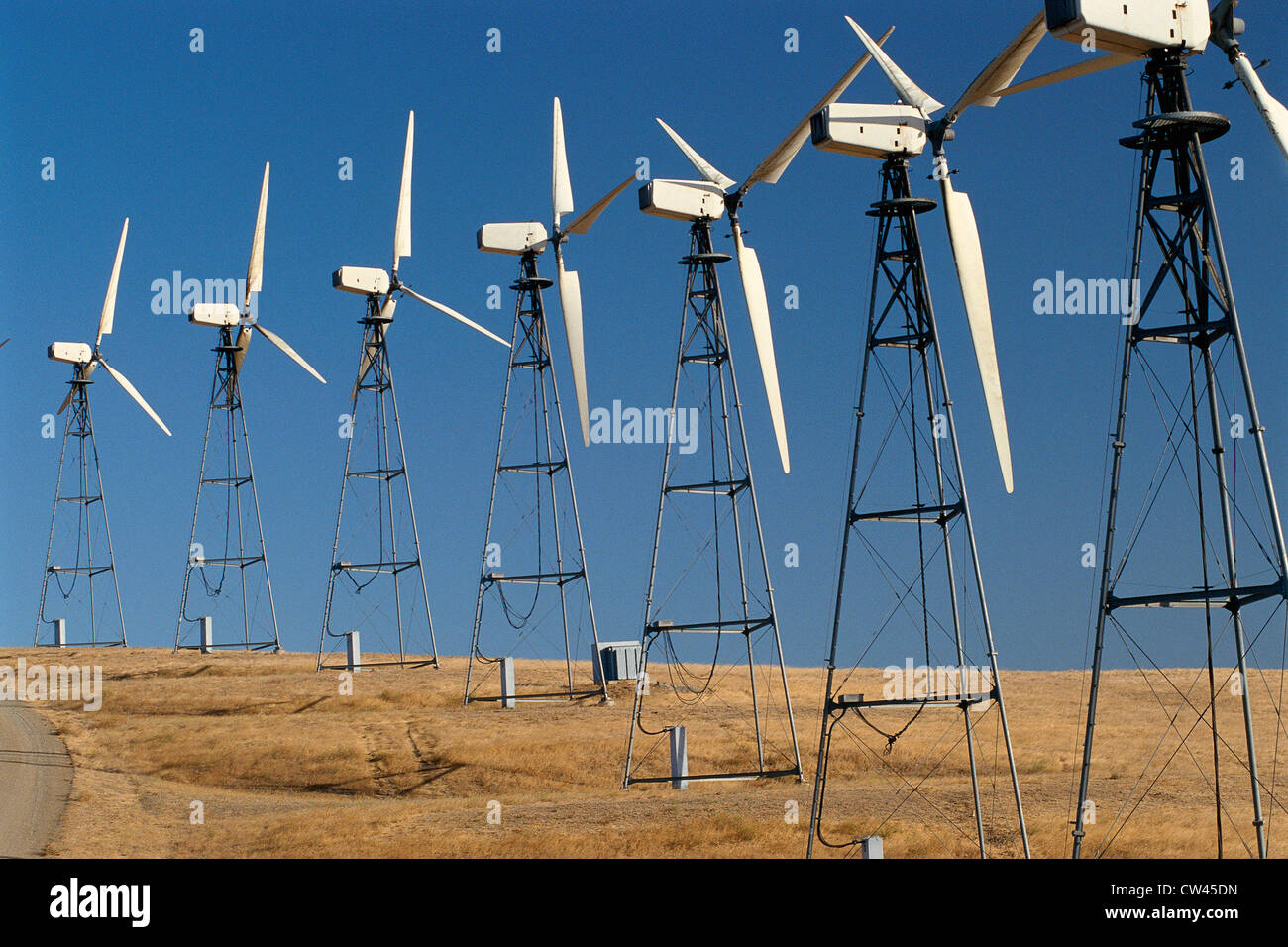 Row of wind turbines on wind farm landscape Stock Photo - Alamy