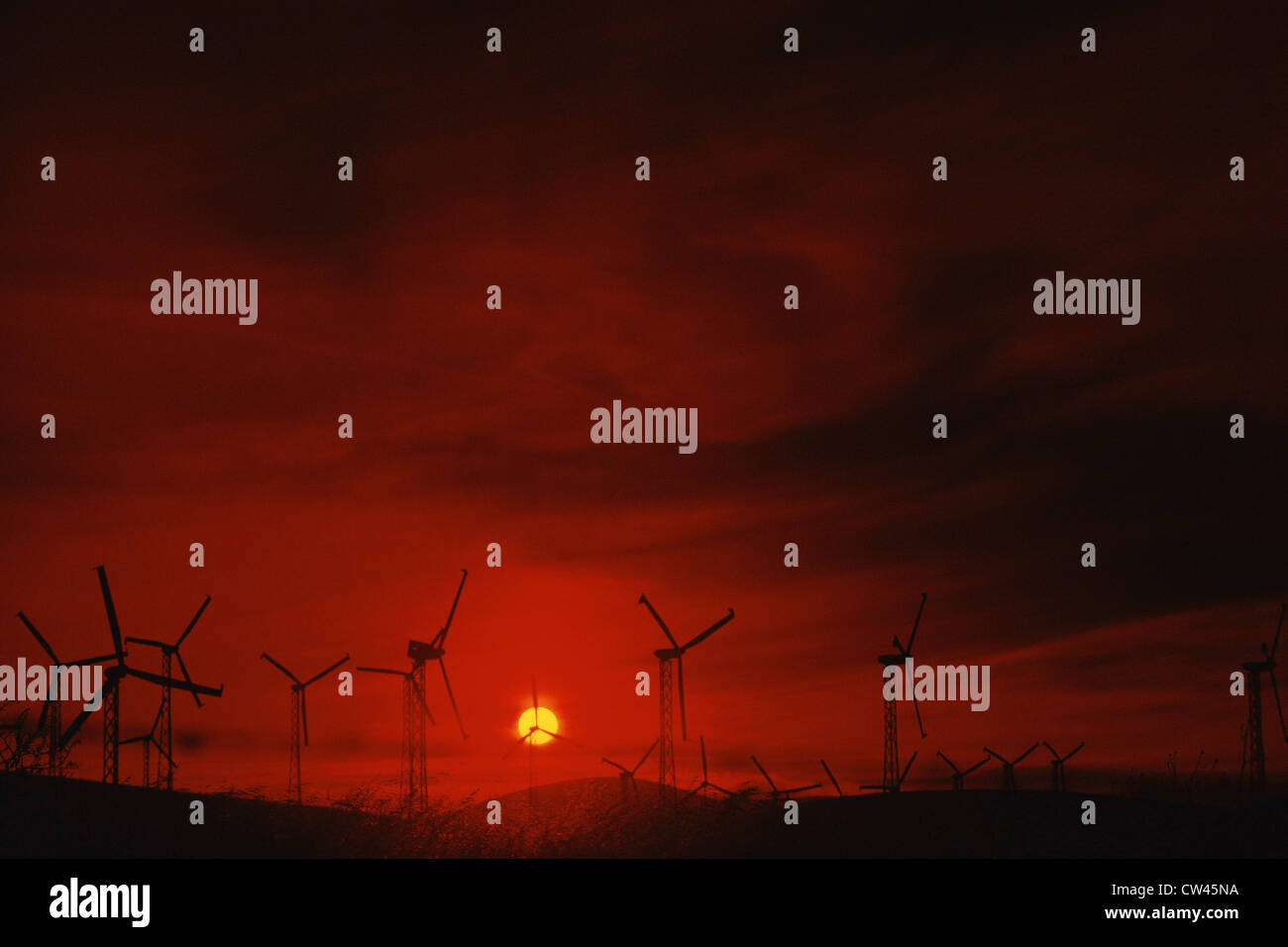 Wind turbines against red sunset Stock Photo - Alamy