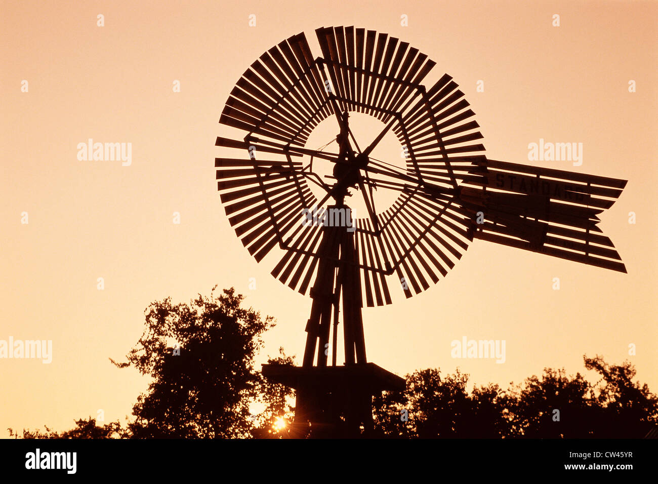 Top of windmill against pale orange sky Stock Photo - Alamy