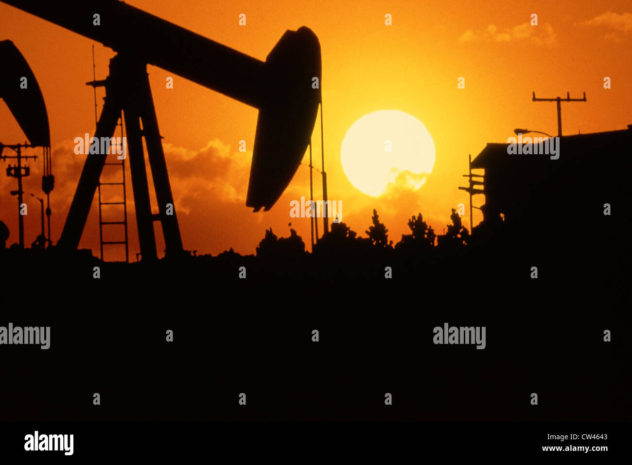 Oil drill at sunset Stock Photo - Alamy