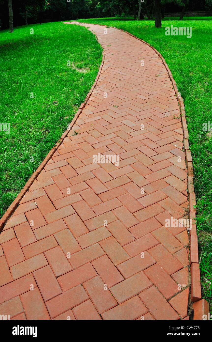 Winding Path through a Peaceful Green Garden Stock Photo - Alamy