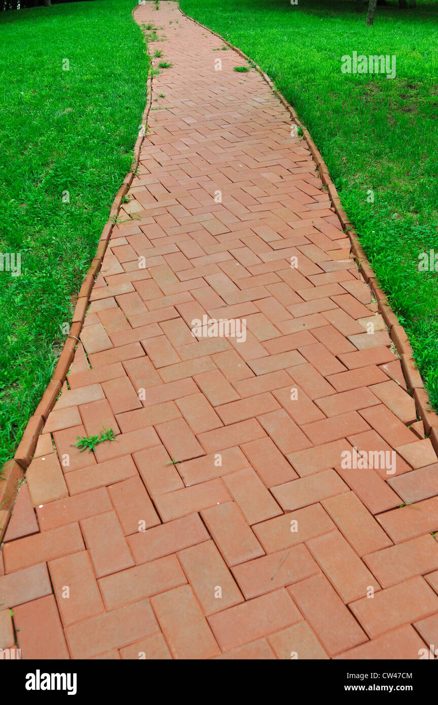 Winding Path through a Peaceful Green Garden Stock Photo - Alamy