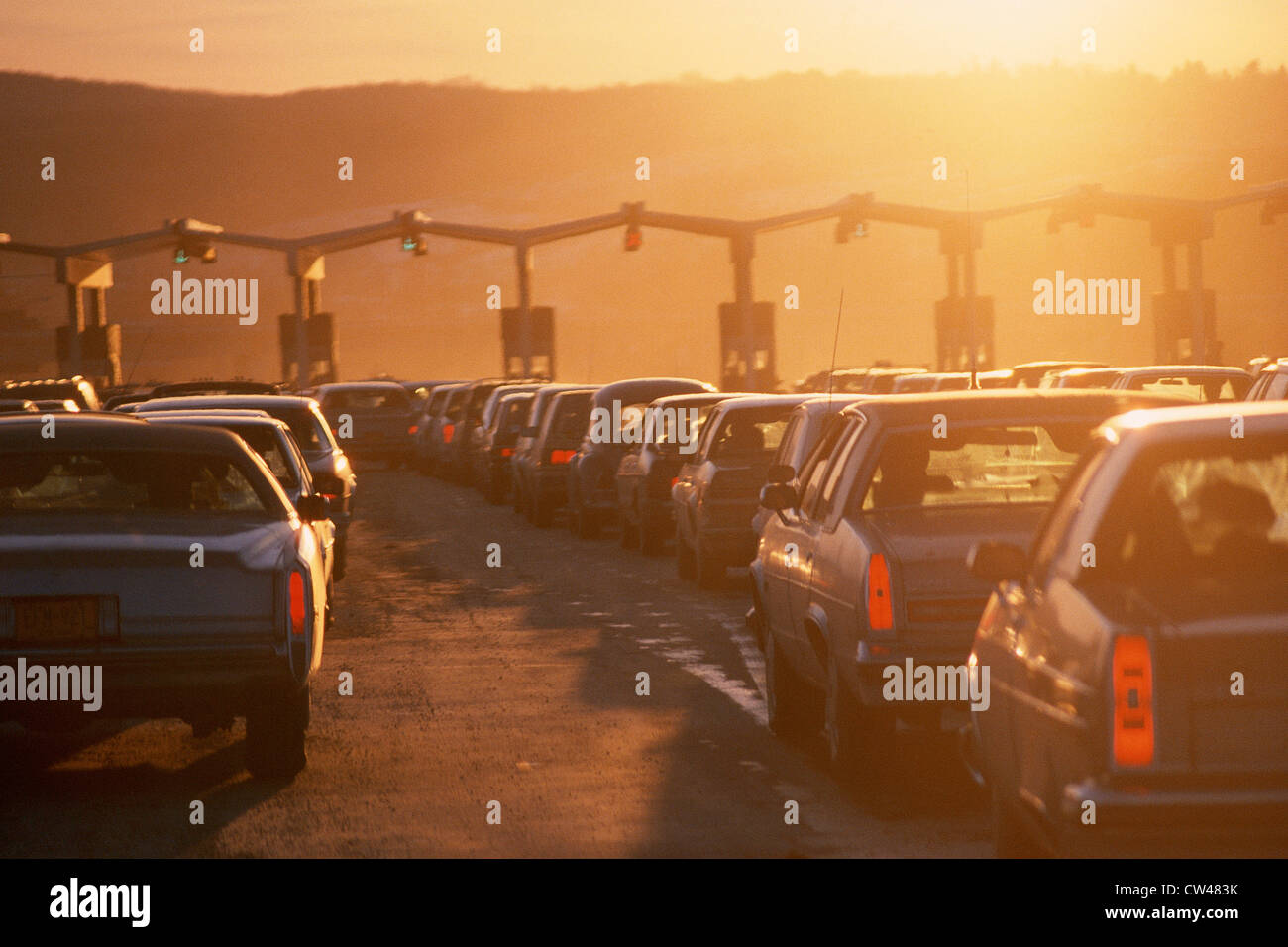 Cars queuing at tollbooth Stock Photo - Alamy