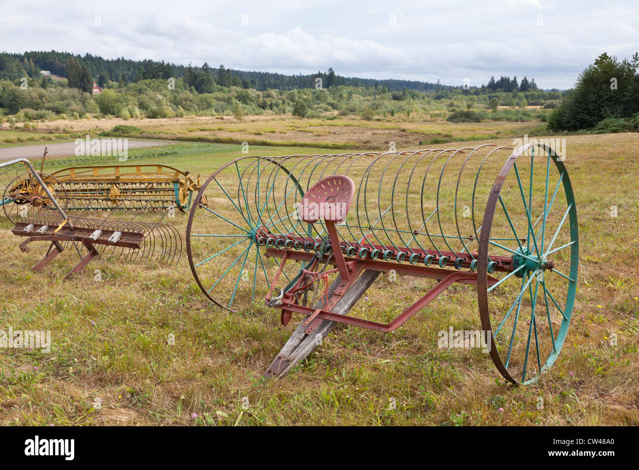 USA, Washington, Silverdale, Historic Petersen Farm, Hay rake Stock ...