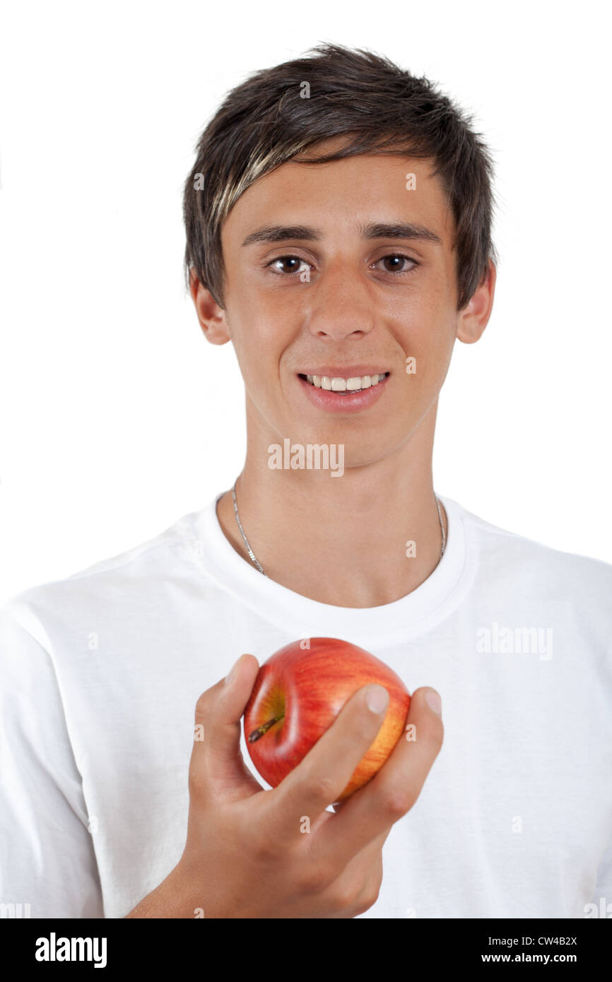 young swarthy man with brown eyes and a red apple in his hand on white ...