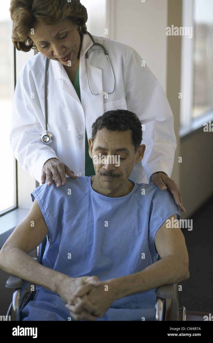 Female doctor with a male patient Stock Photo - Alamy