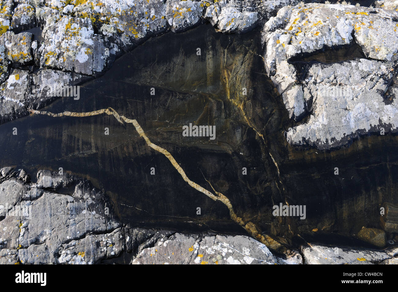 Rock pool with a white vain running through black stone, Lettermullan ...