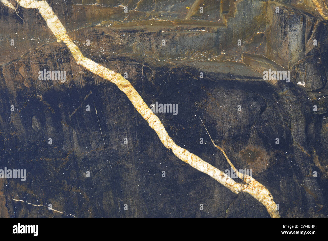Rock pool with a white vain running through black stone, Lettermullan ...