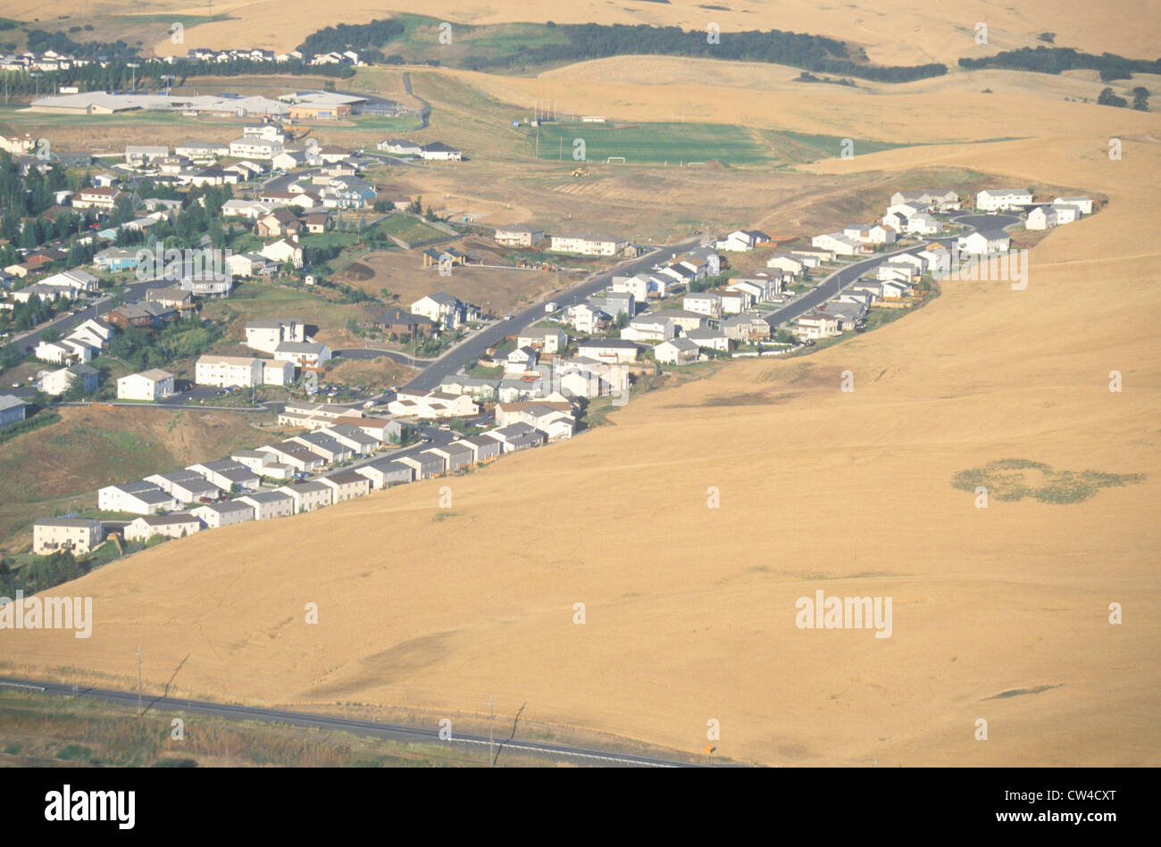 An aerial view of a housing development and wheat field Stock Photo - Alamy