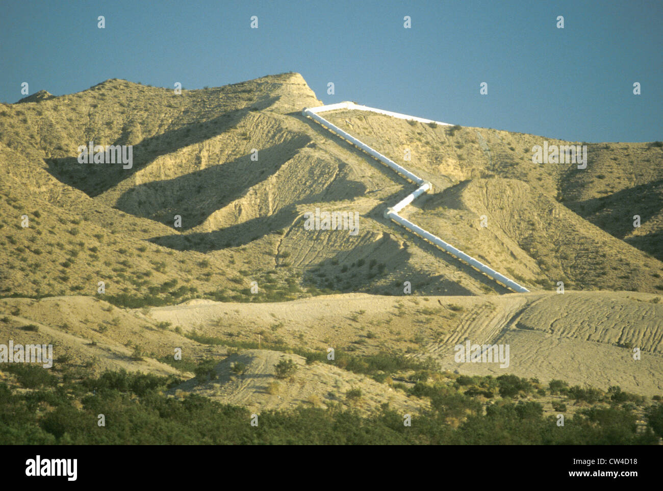 An aqueduct which supplies water to Los Angeles winding down a hill in ...