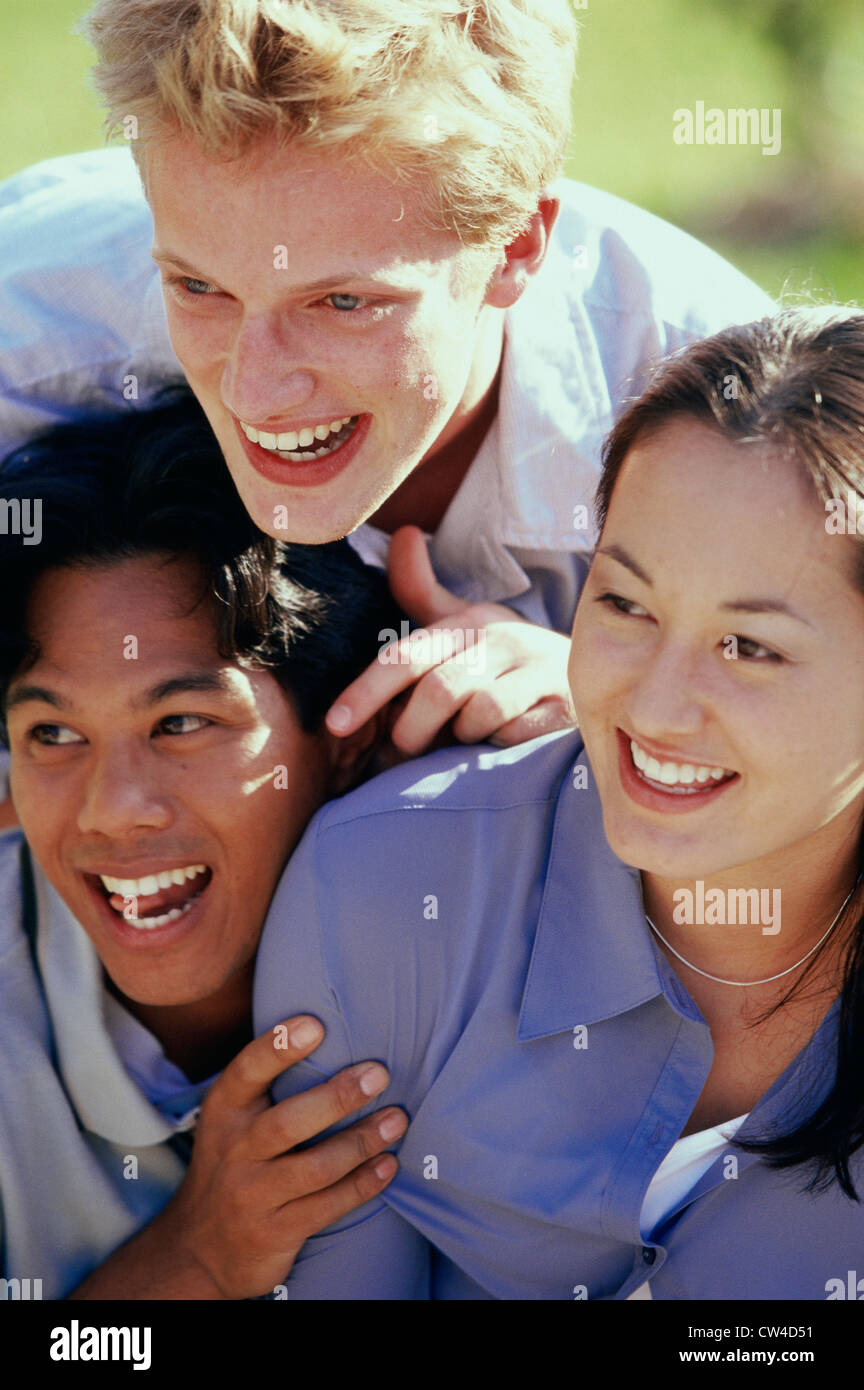 Close-up of two teenage boys and a teenage girl smiling Stock Photo - Alamy
