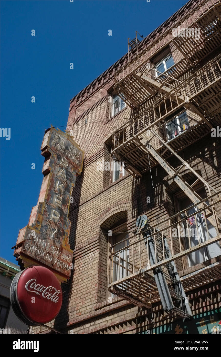Bakery Shop Front with Vintage Coca Cola Sign and Rusty Fire Escape on ...