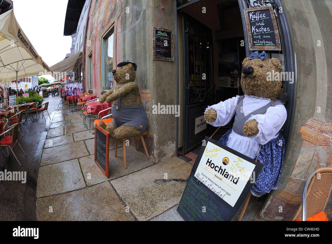 Male and female bears made from straw and dressed in traditional German ...