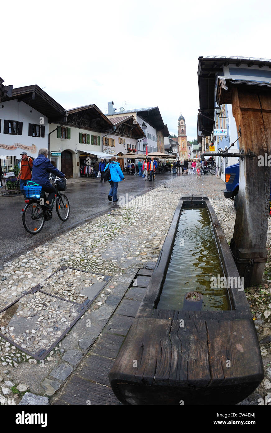Wet and damp street after a rain shower in Mittenwald, Germany Stock ...