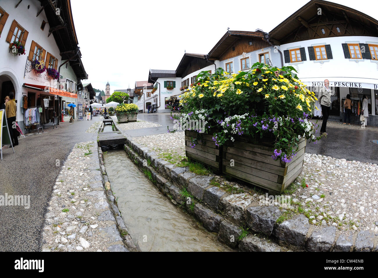 Wet and damp street after a rain shower in Mittenwald, Germany Stock ...