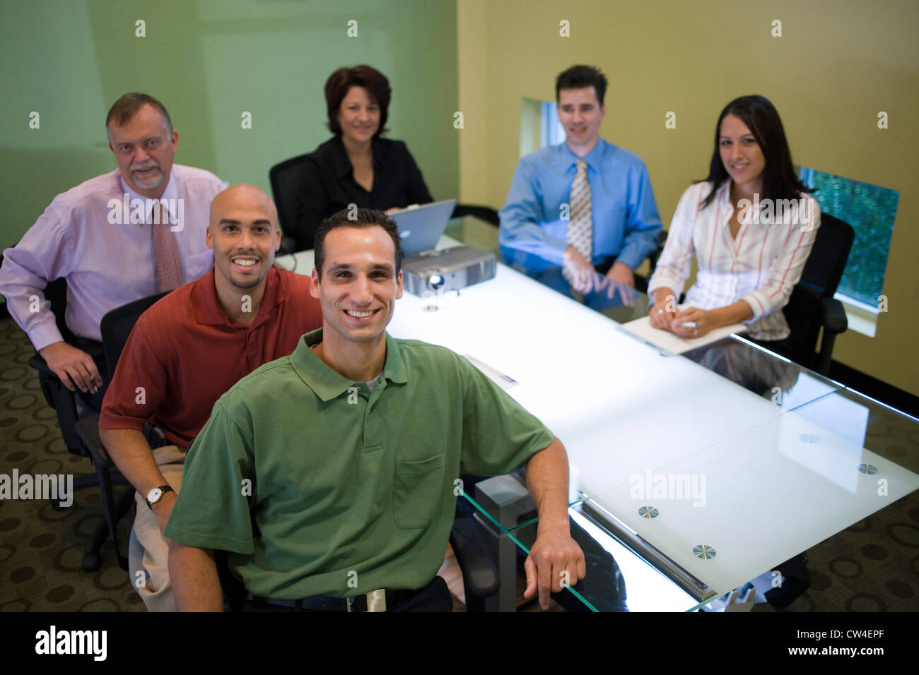 Executives Sitting Around Conference Table High Resolution Stock ...
