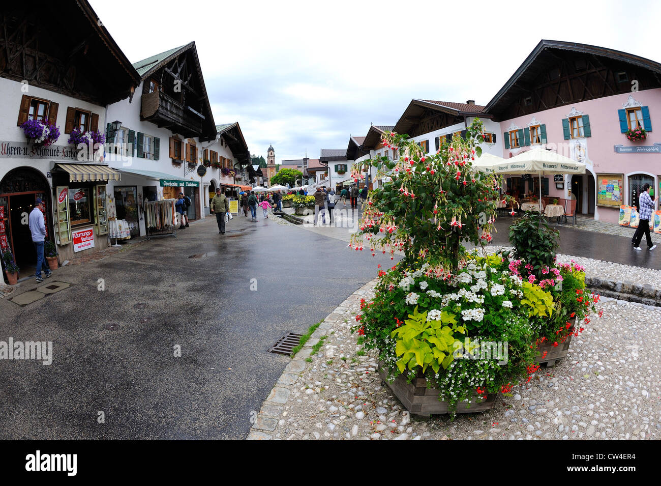 Wet and damp street after a rain shower in Mittenwald, Germany Stock ...