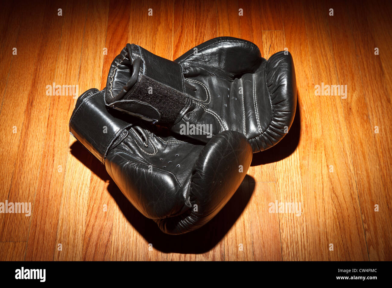 Boxing gloves on gym floor Stock Photo - Alamy