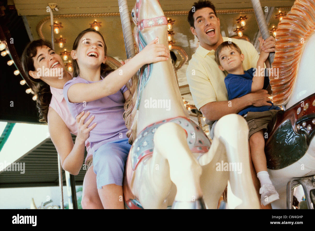 Women riding on carousel hi-res stock photography and images - Alamy