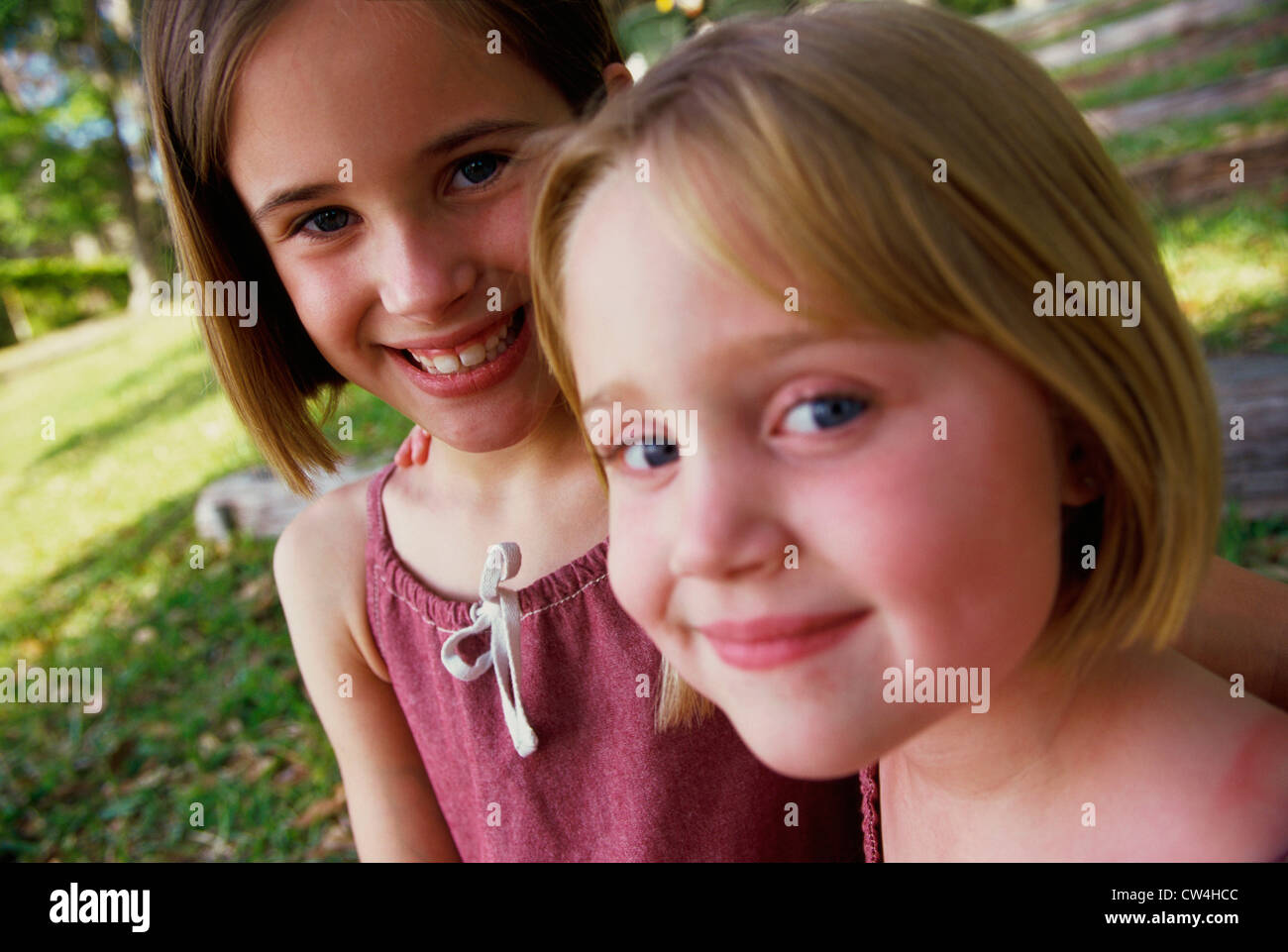 Portrait of two girls smiling Stock Photo - Alamy