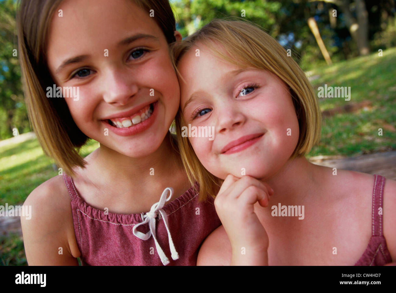 Portrait of two girls smiling Stock Photo - Alamy
