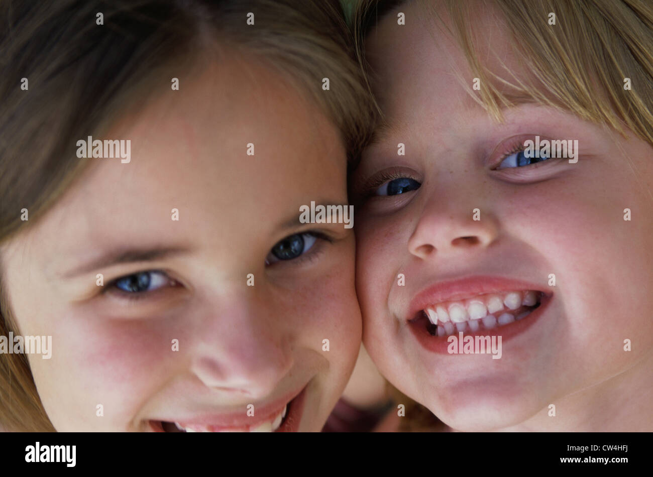 Portrait of two girls smiling Stock Photo - Alamy
