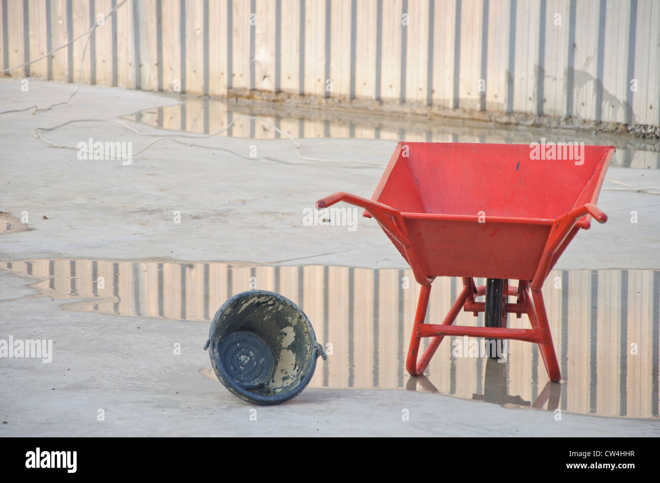 concrete wheel barrow for man power Stock Photo - Alamy