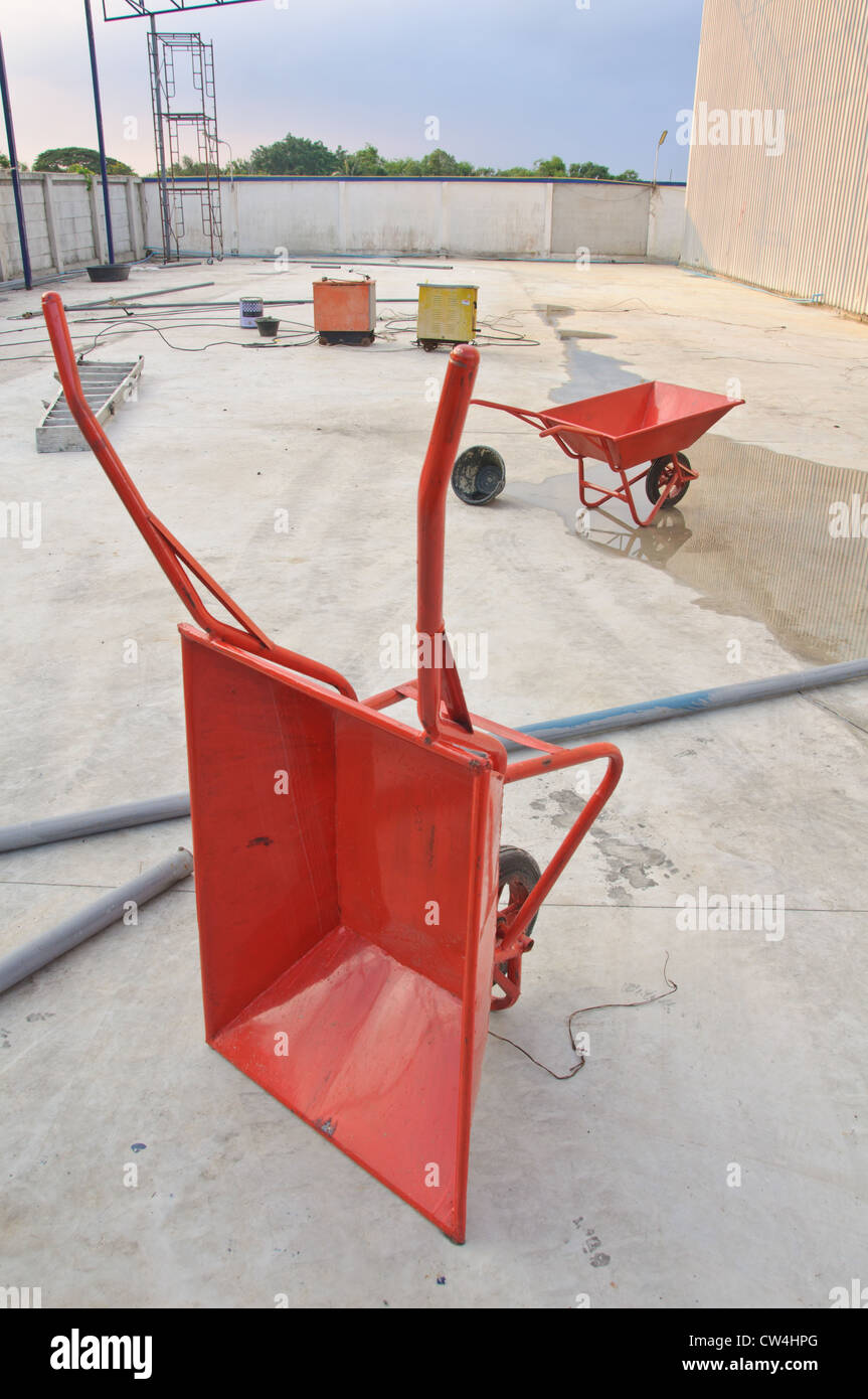 concrete wheel barrow for man power Stock Photo - Alamy