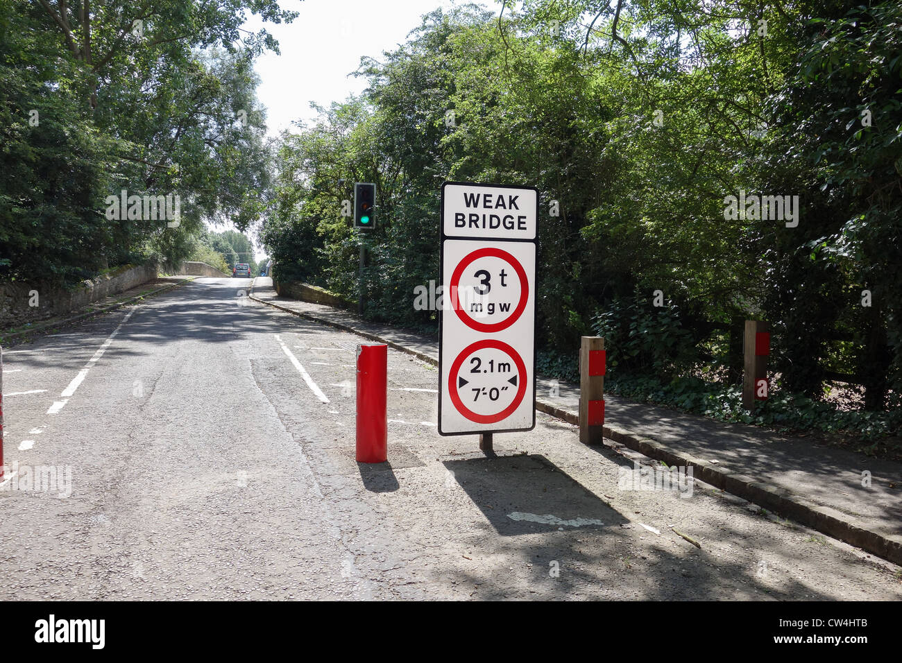 Road narrowing over a weak bridge Stock Photo - Alamy