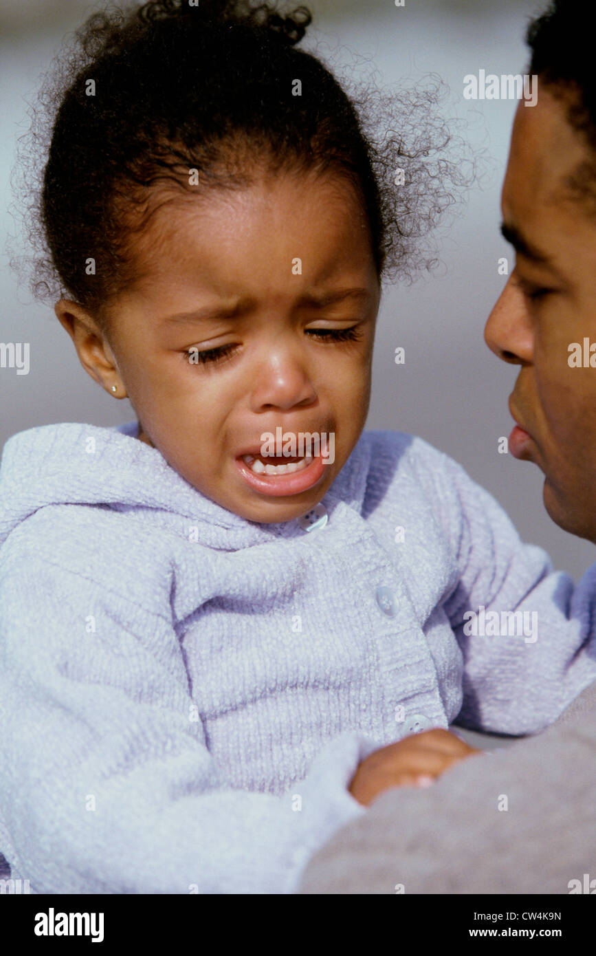 Father carrying crying child hi-res stock photography and images - Alamy