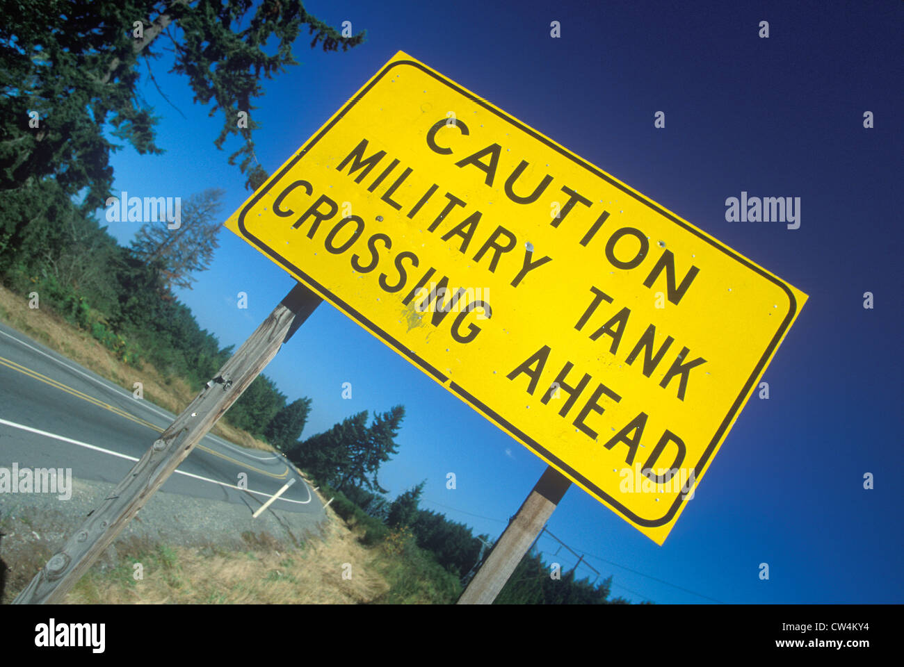 A sign that reads ?Caution - Military tank crossing ahead Stock Photo ...