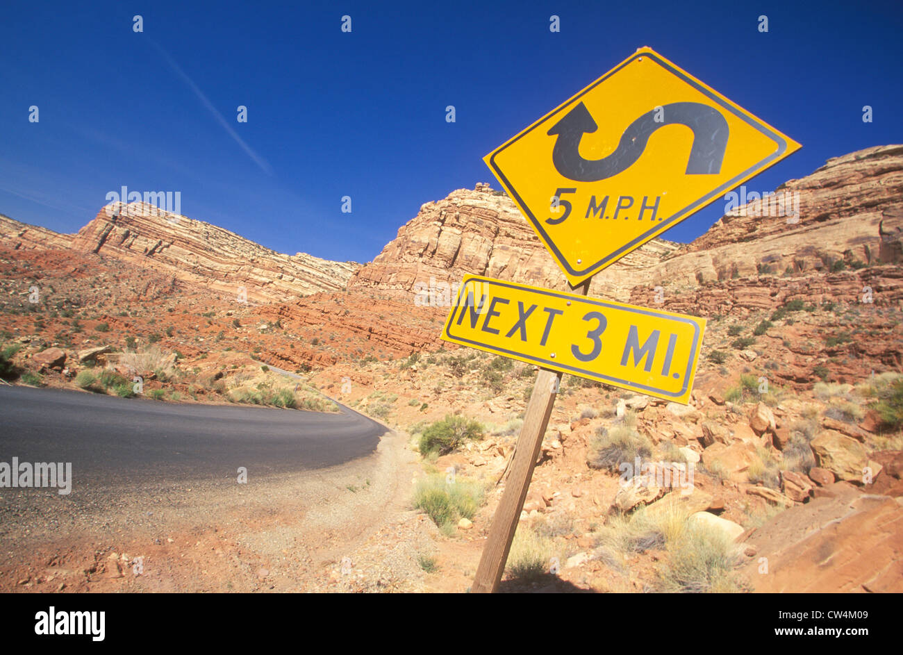 Windy road sign Stock Photo - Alamy