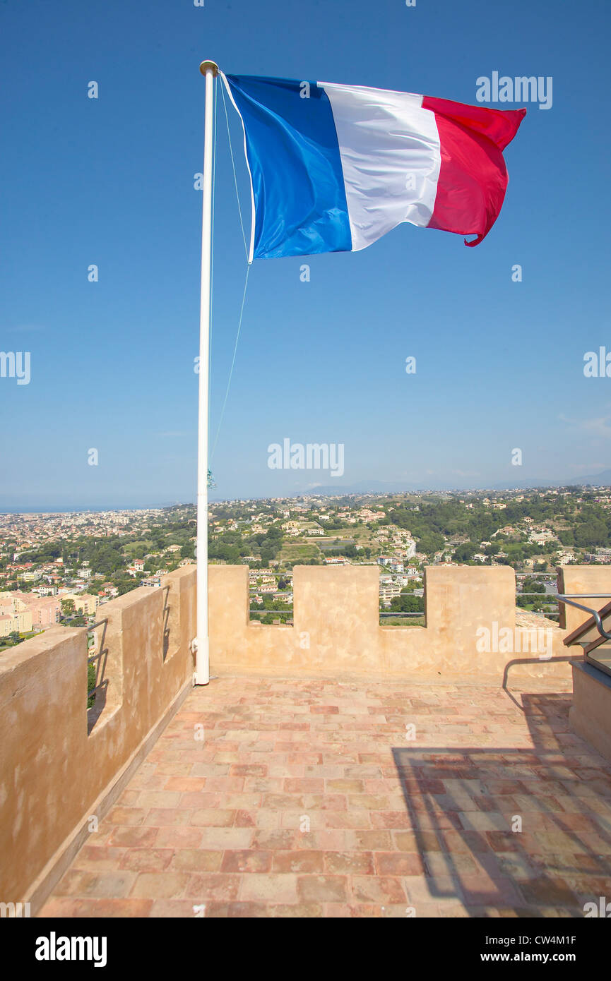 The flag of France flying from the Chateau Grimaldi, Haut de Cagnes ...