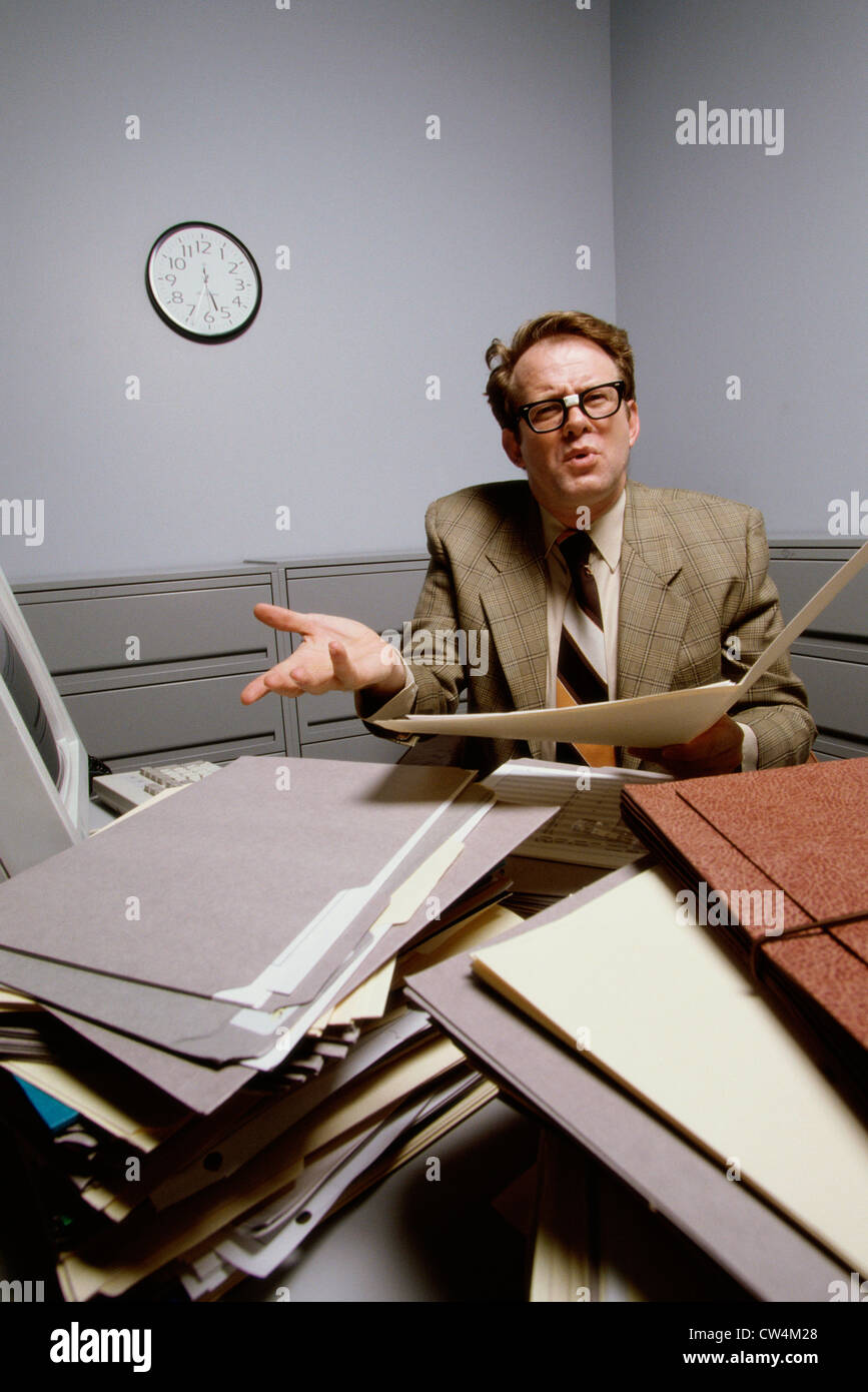 Portrait of a businessman holding a file Stock Photo - Alamy