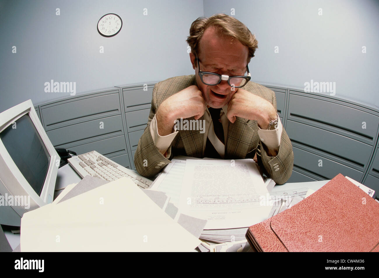 Young man crying over keyboard hi-res stock photography and images - Alamy