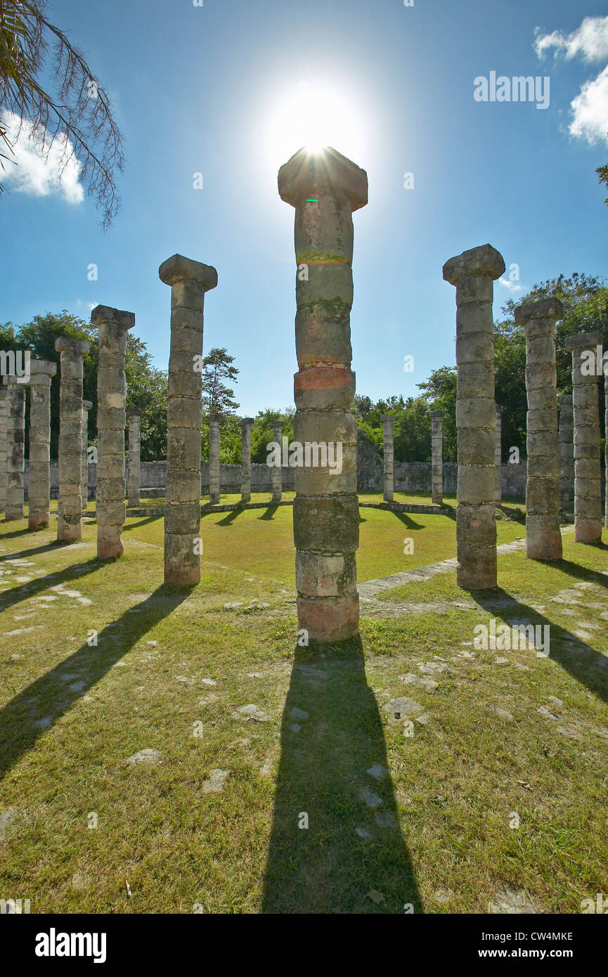 Columns surrounding grassy courtyard for ballgames at Chichen Itza ...