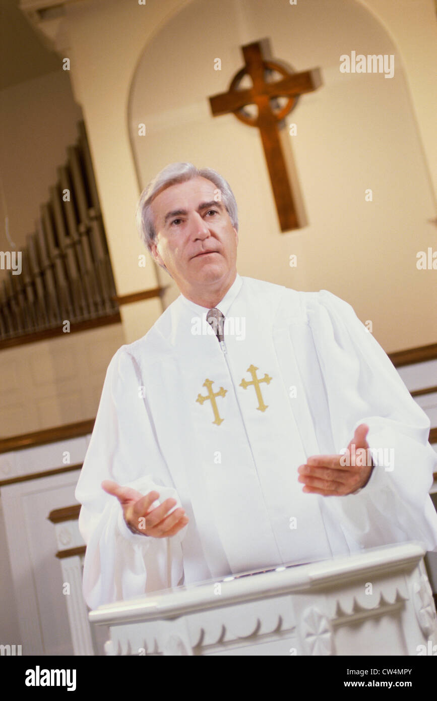 Priest addressing people in a church Stock Photo - Alamy