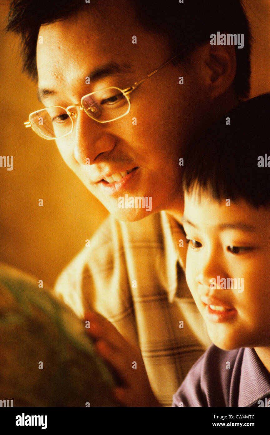 Close-up of a father teaching his son Stock Photo - Alamy