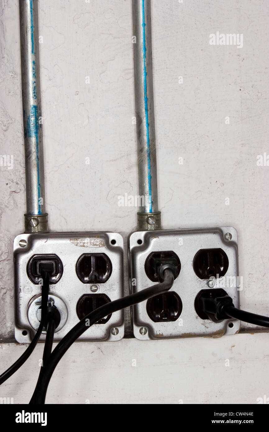Close-up of electric plugs in power sockets Stock Photo - Alamy