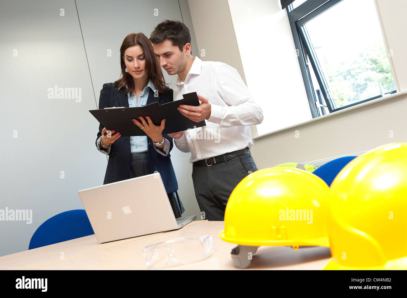 construction workers in office meeting Stock Photo - Alamy