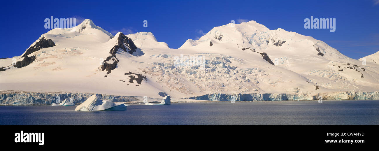 Panoramic view of glaciers and iceberg in Paradise Harbor, Antarctica ...