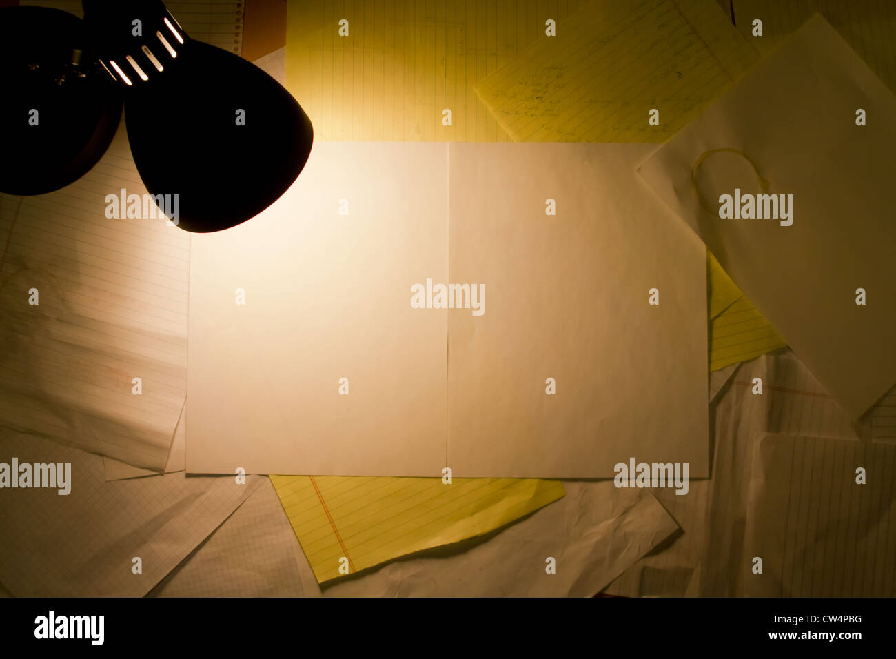 A messy desktop with scattered papers and a blank section to ...